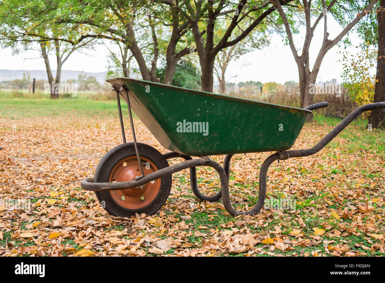 Photo of used old wheelbarrow in a farm yard Stock Photo - Alamy