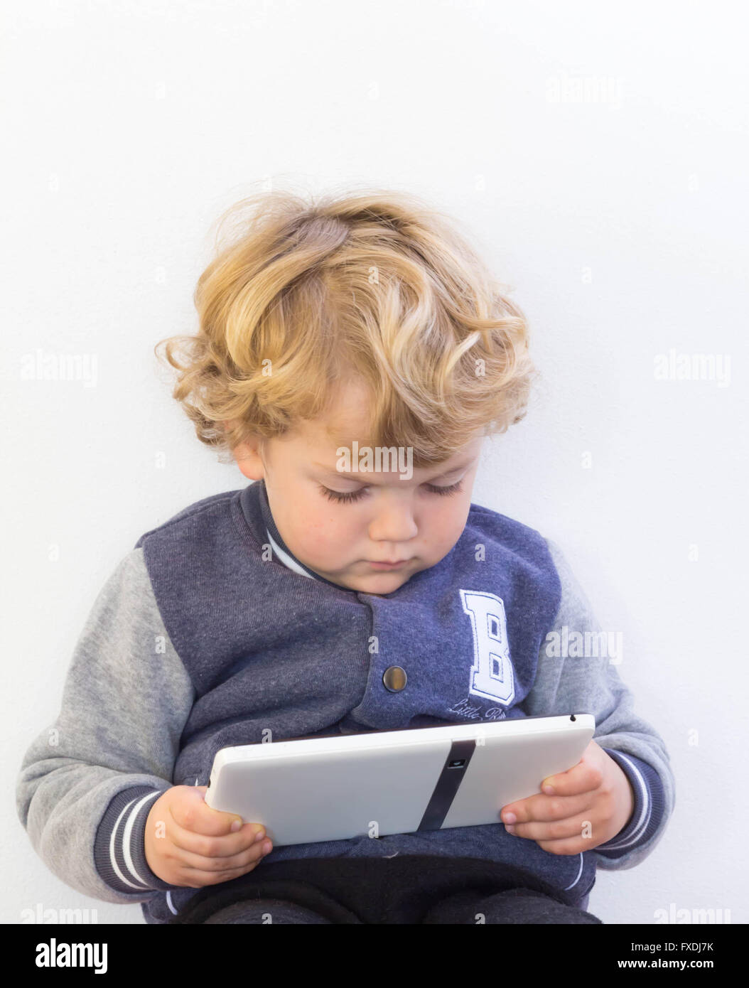 Shot of toddler playing a game on a digital tablet Stock Photo - Alamy