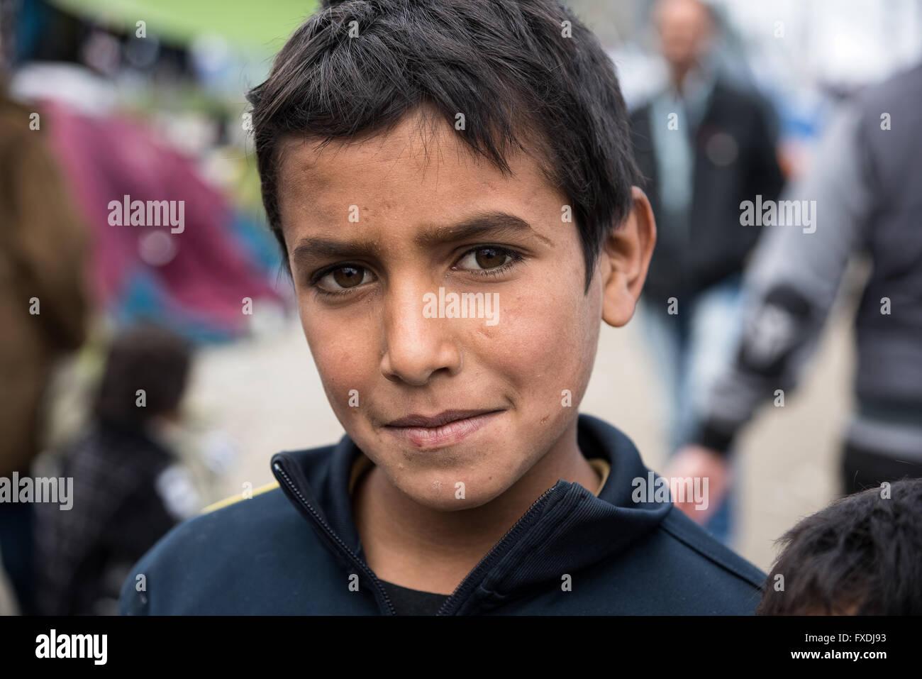 A boy from Syria poses near his tent on March 17, 2015 in the refugee ...