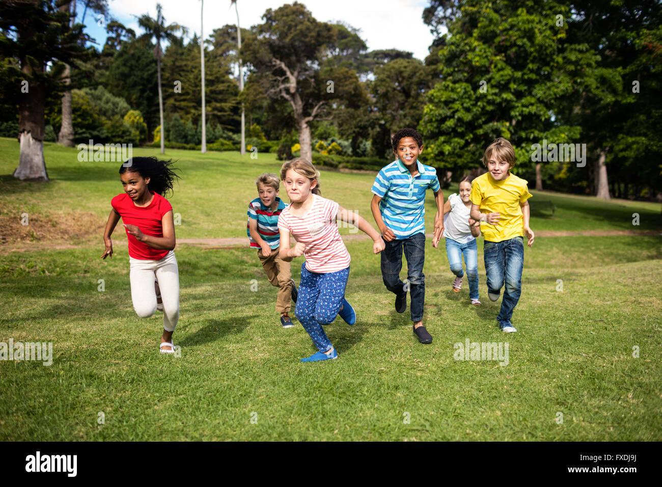 Children running in the park Stock Photo - Alamy