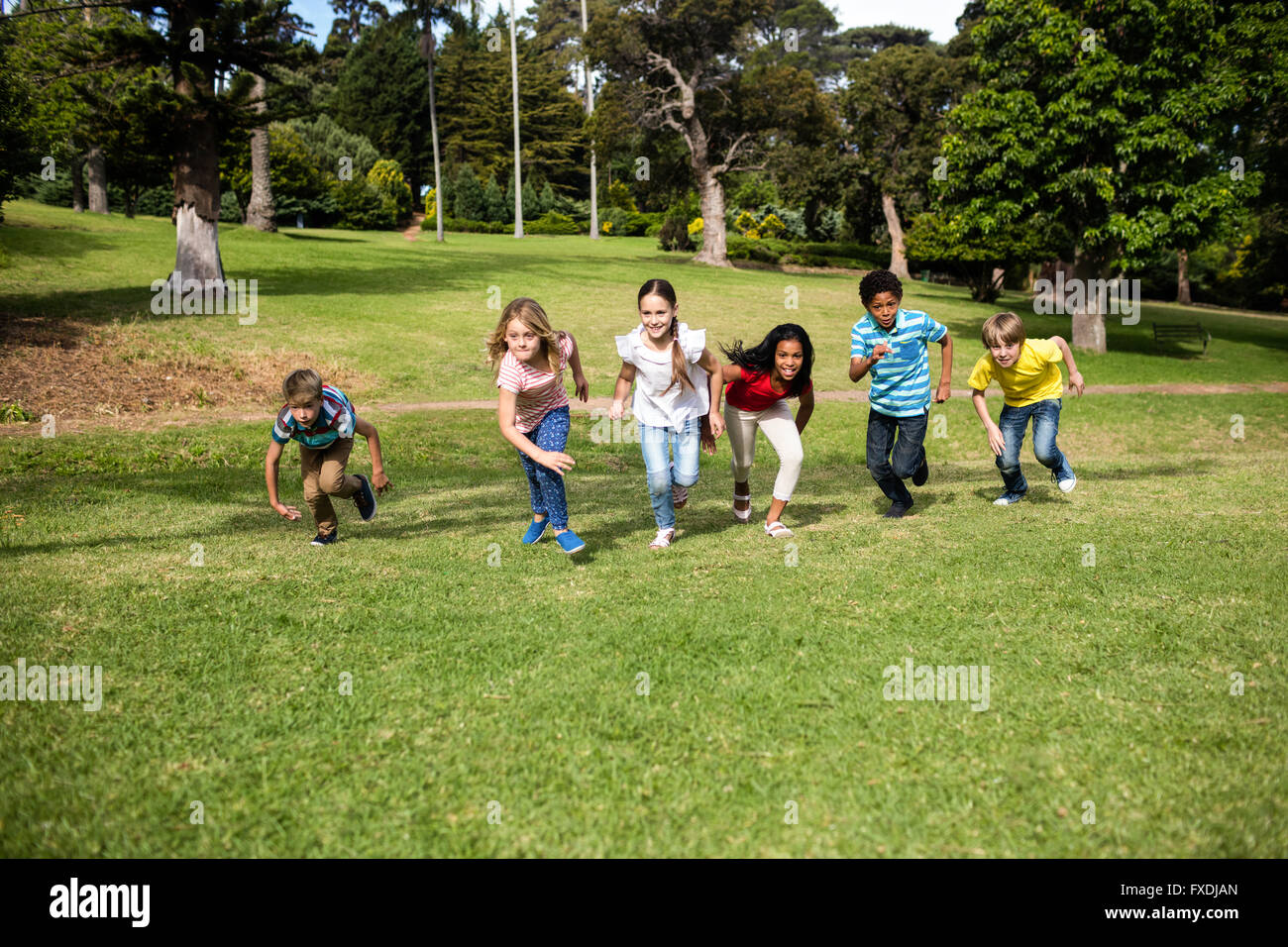 Children running in the park Stock Photo - Alamy