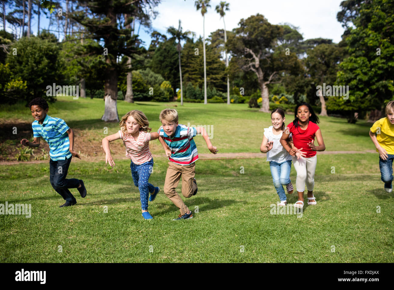 Children running hi-res stock photography and images - Alamy