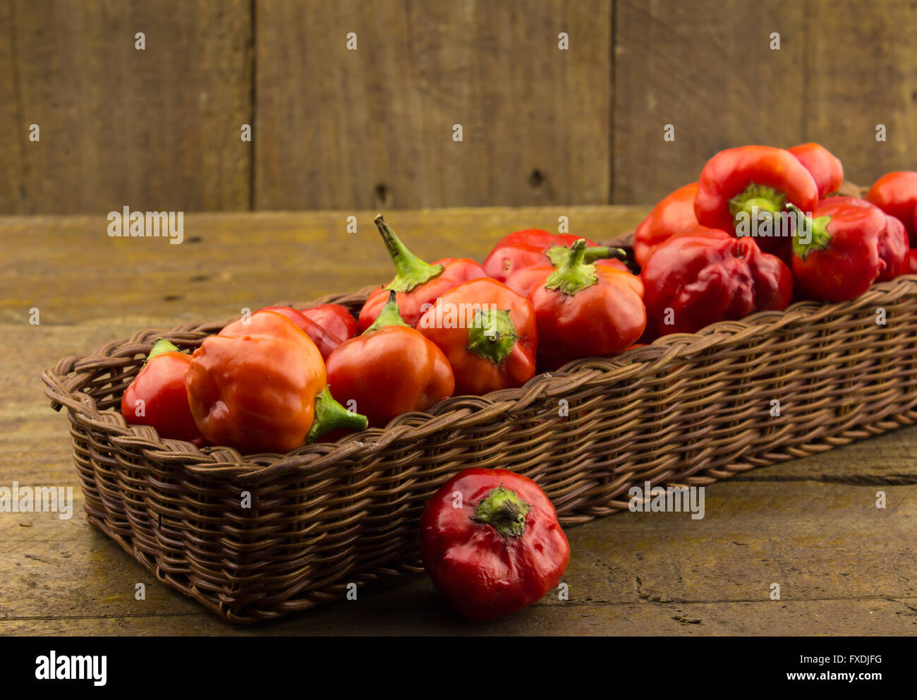 Chili peppers on rustic background hi-res stock photography and images ...