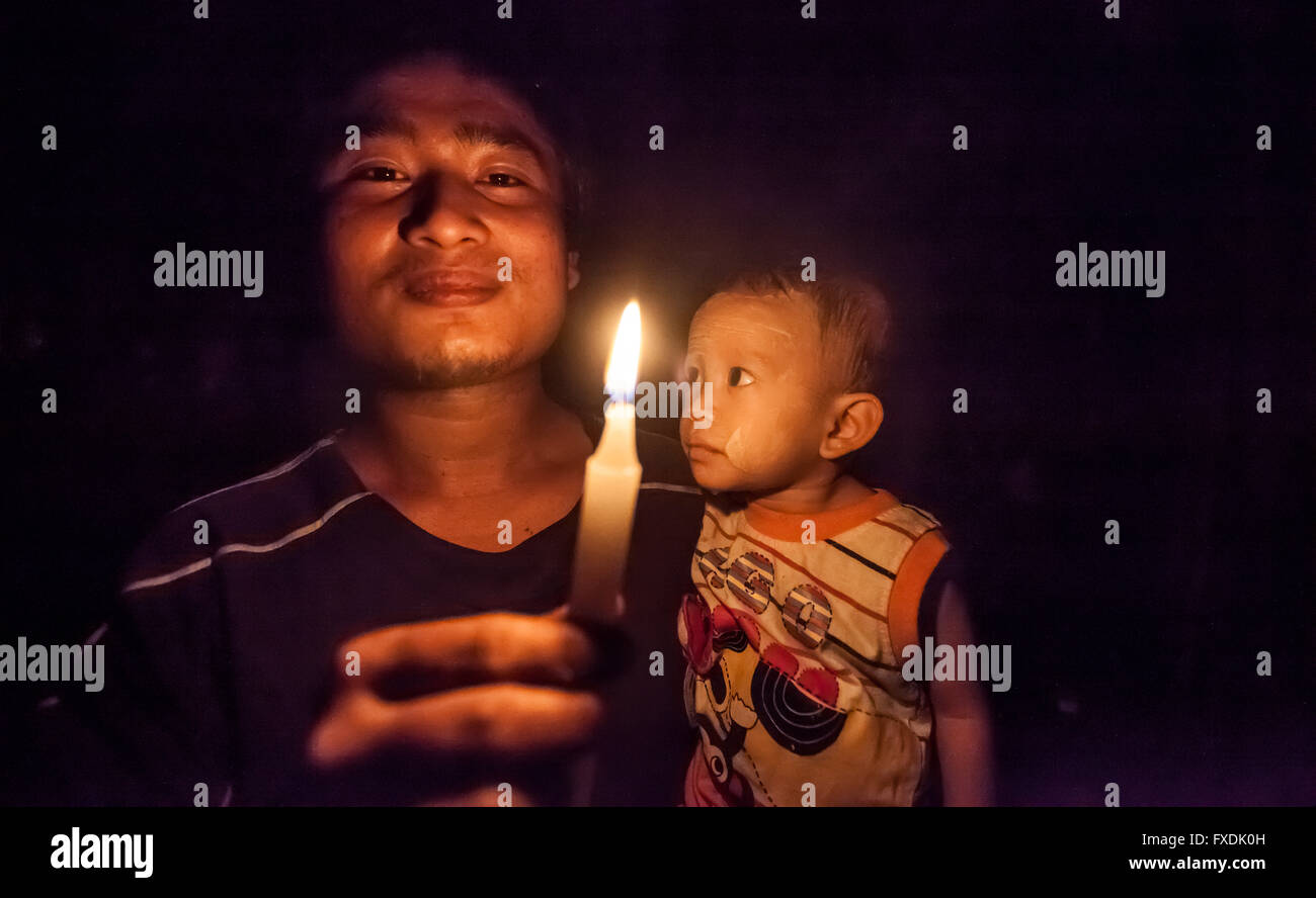 Myanmar, Asia, father with son taking a candle Stock Photo - Alamy