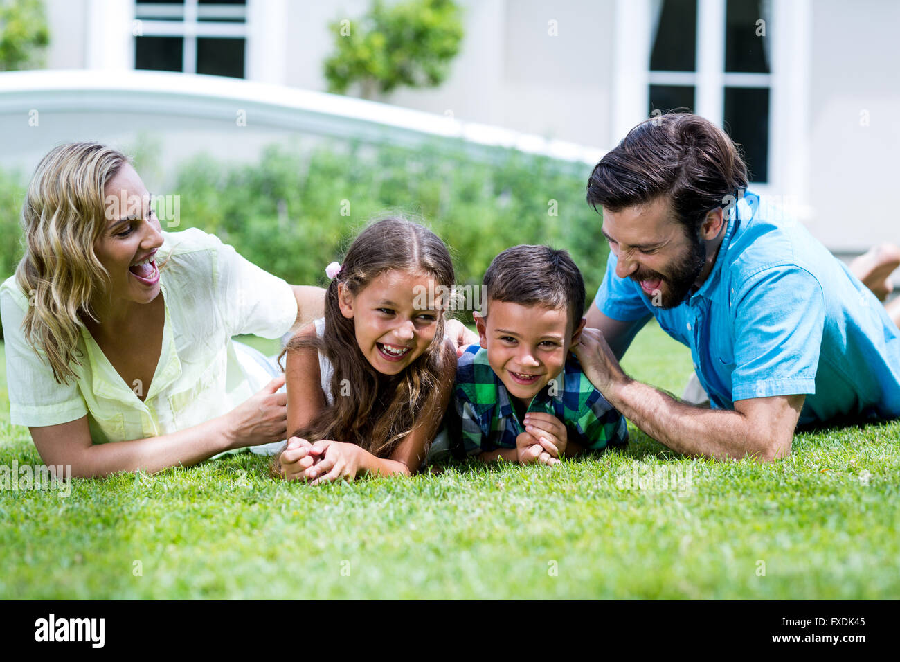 Children lying parents hi-res stock photography and images - Alamy