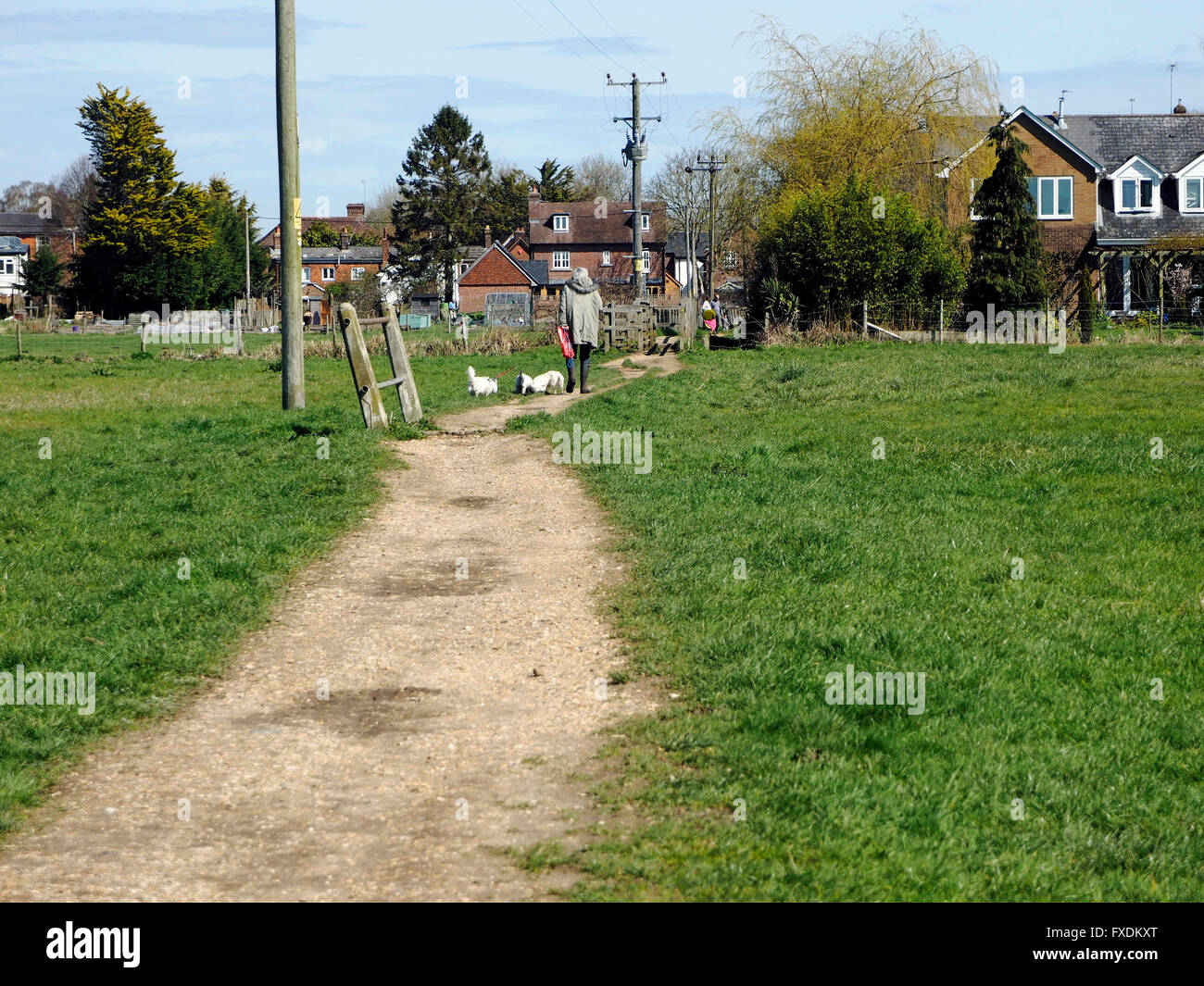 Well worn footpath leading from water meadows to the pretty town of ...