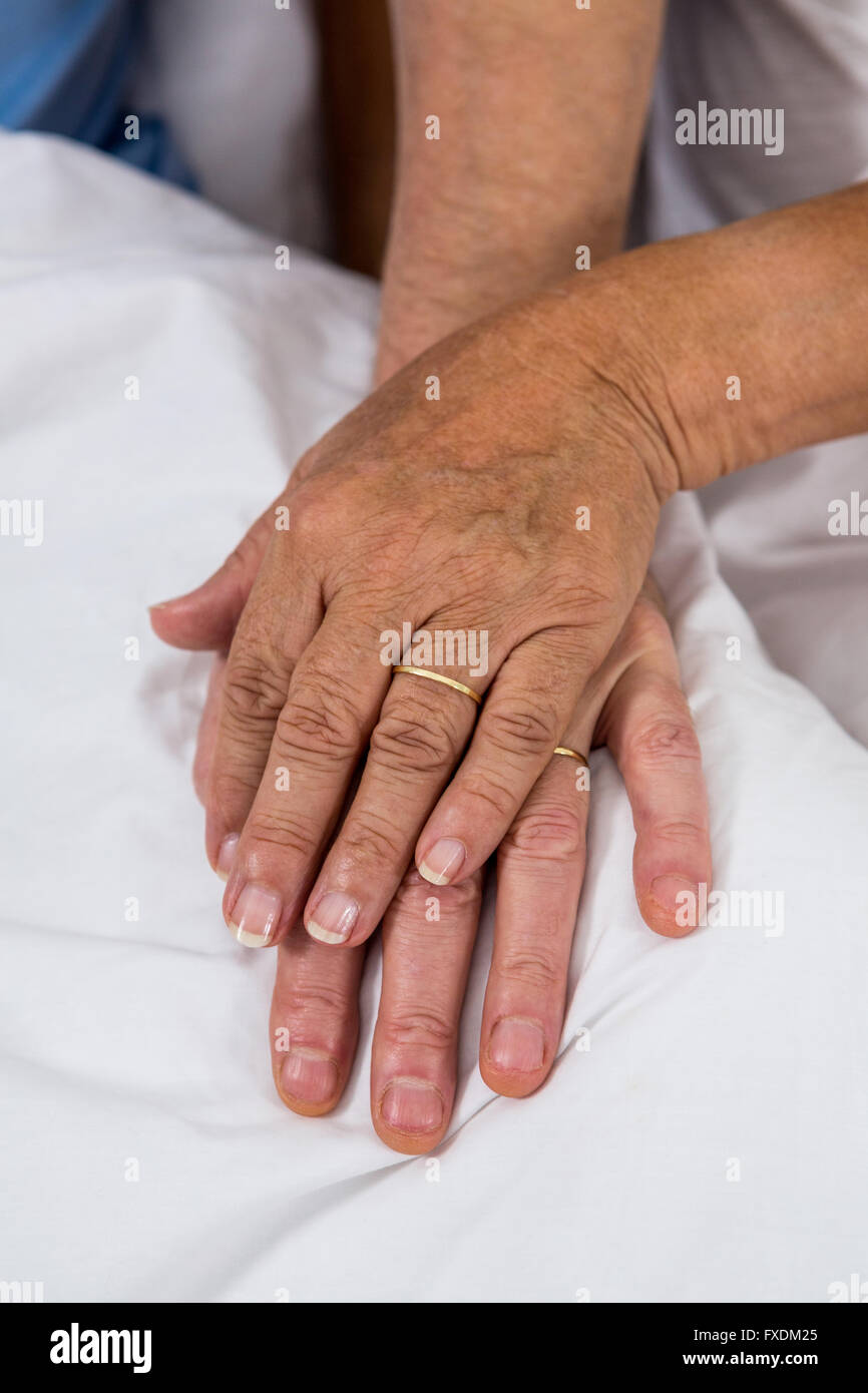 Hands touching hands hi-res stock photography and images - Alamy