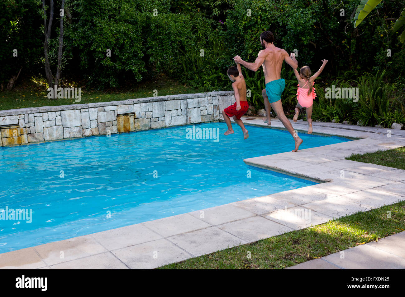 Man jumping pool hi-res stock photography and images - Alamy