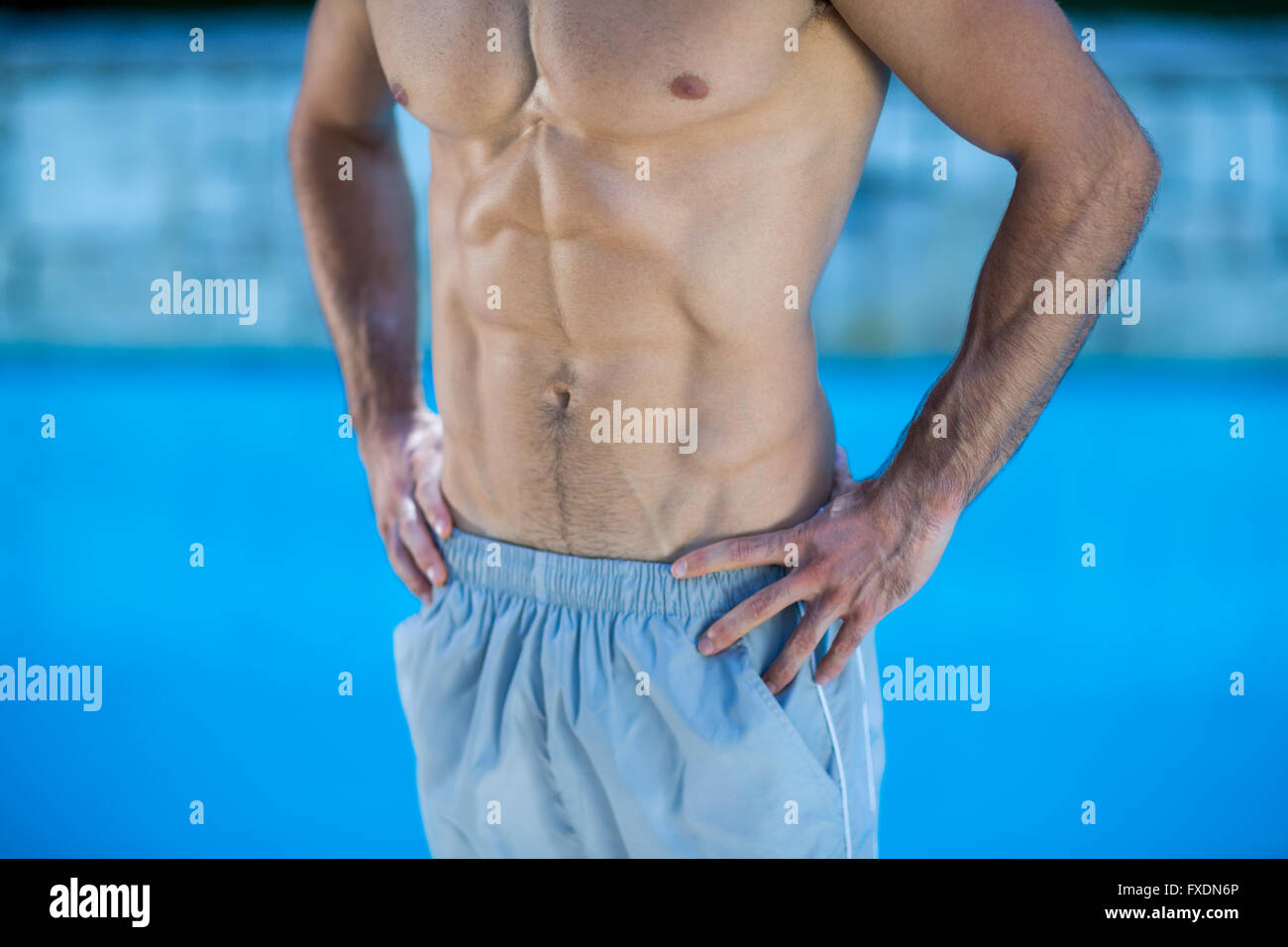 Midsection of muscular man showing his body Stock Photo - Alamy