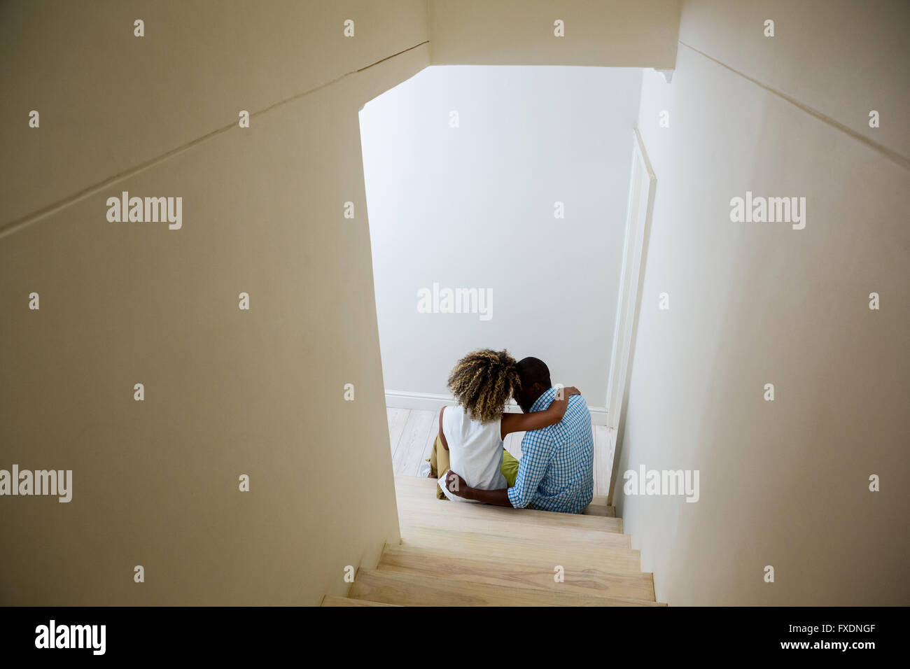 Couple sitting on steps hi-res stock photography and images - Alamy