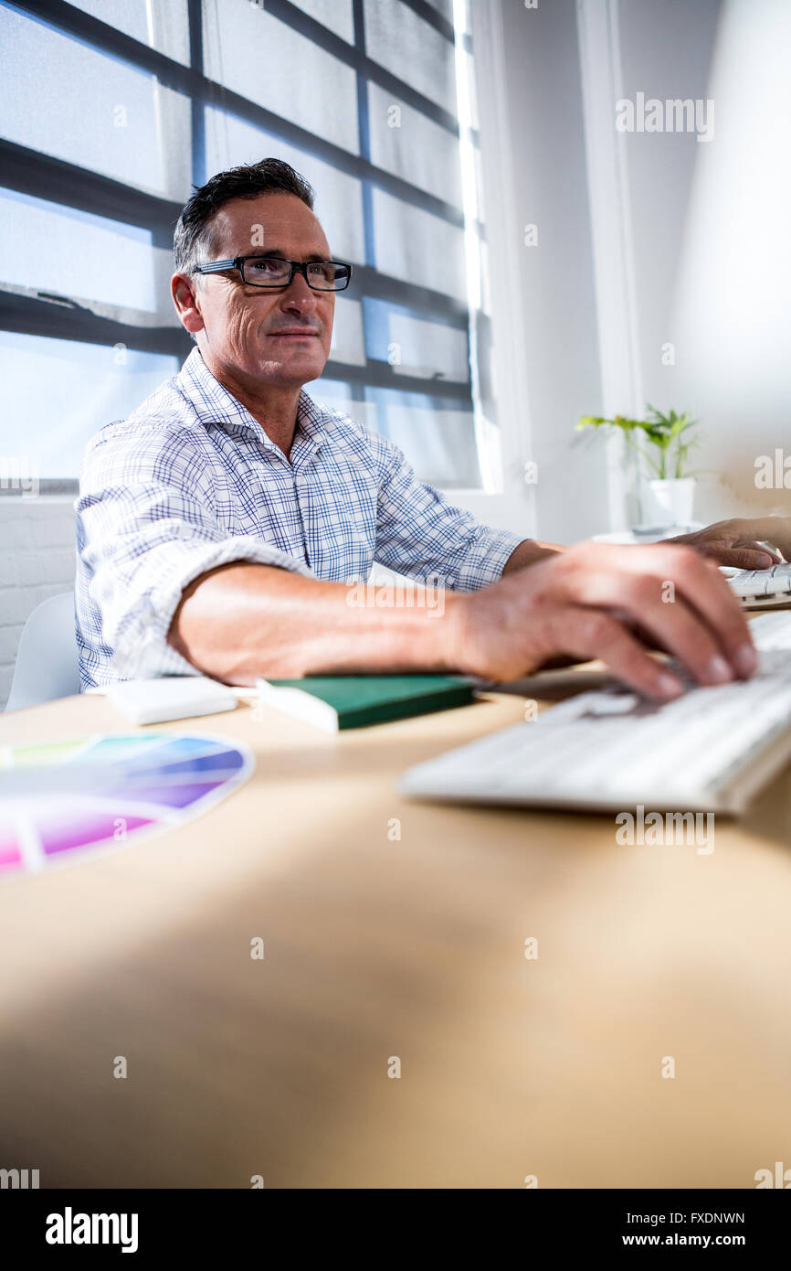 Man working on computer Stock Photo - Alamy