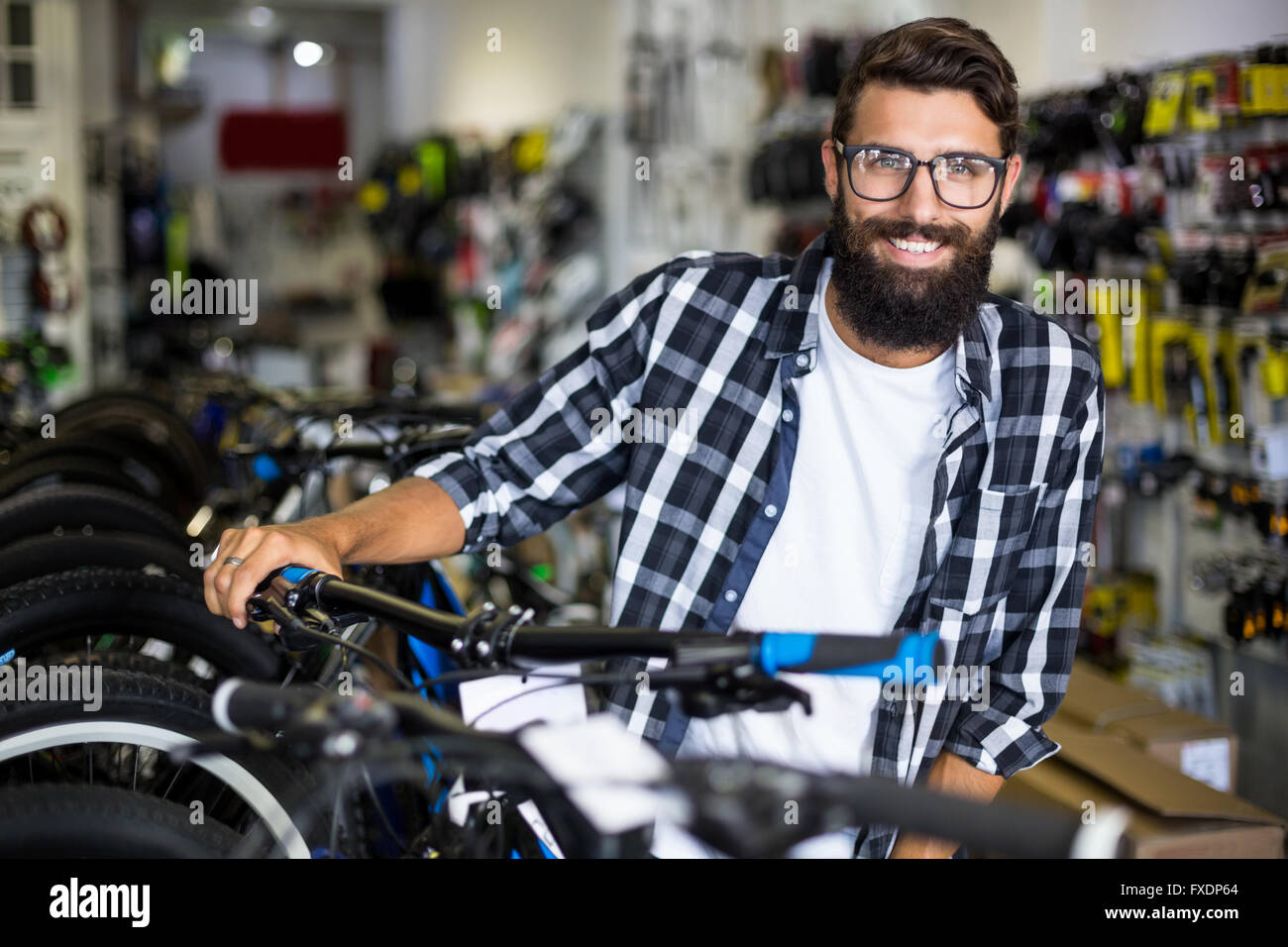Bike mechanic checking bicycles in bike repair shop Stock Photo - Alamy
