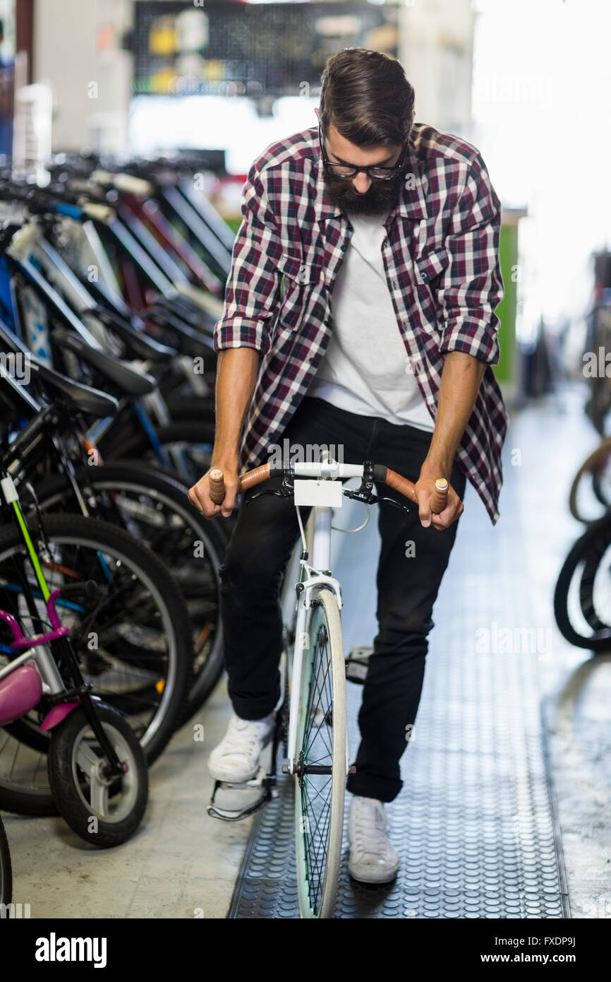 Cool hipster riding a bicycle Stock Photo - Alamy