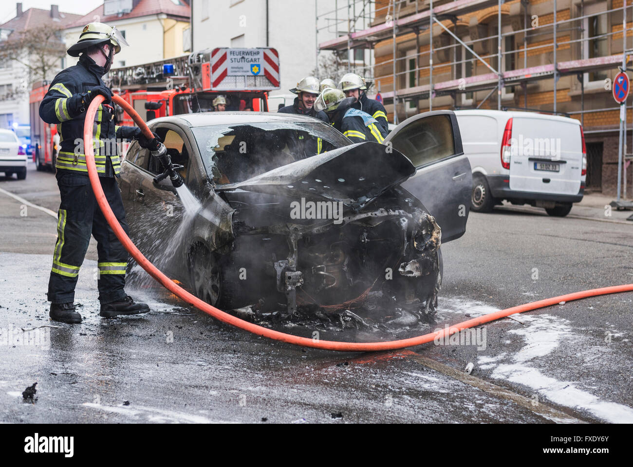 Fire department extinguishing a burning Corsa, burnt engine compartment ...