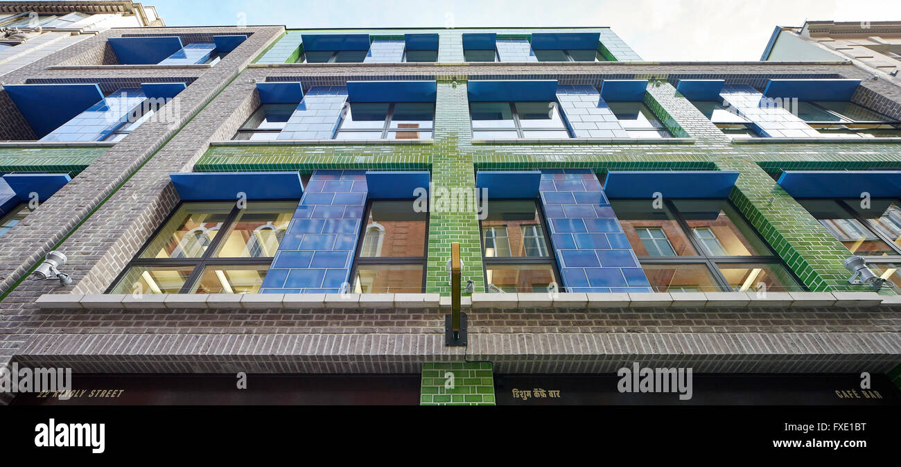 Brickwork, colorful glazed brick and window reveals viewed from below ...