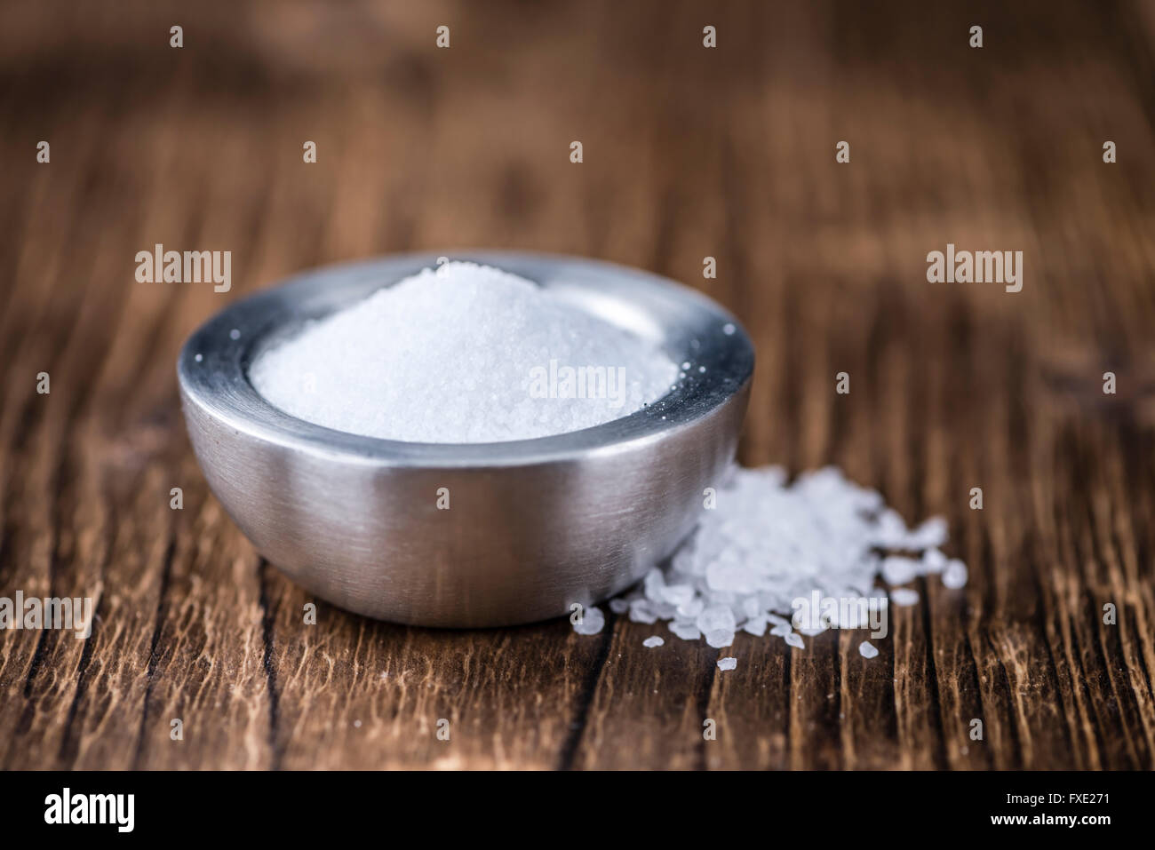 Crushed Salt (close-up shot) on rustic wooden background Stock Photo ...