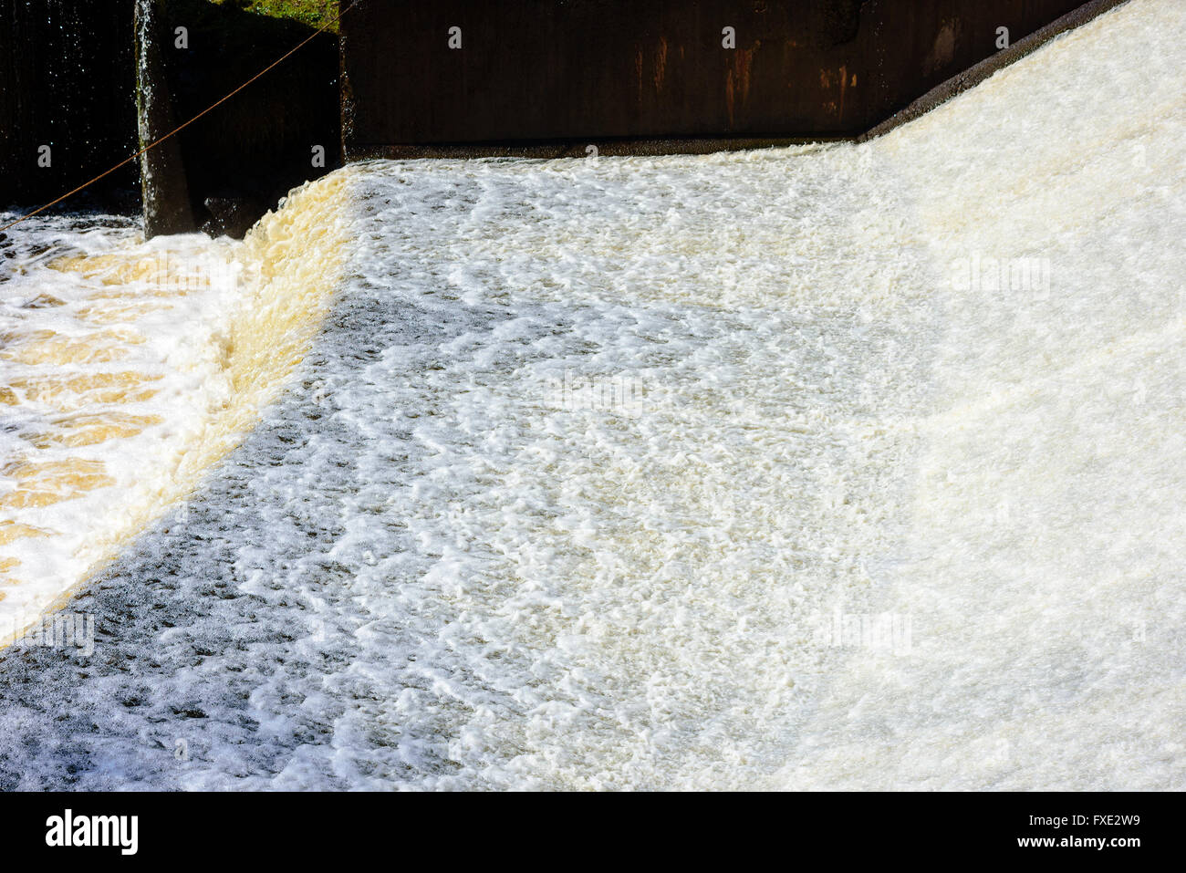 Shallow and sparkling freshwater stream down an overflow in Lyckeby ...