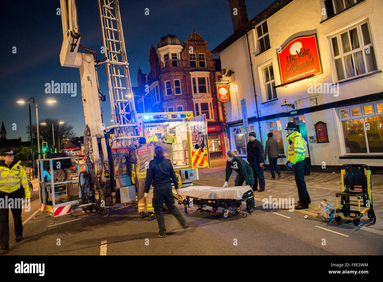 999 emergency services: ambulance and fire engine using an extending ...