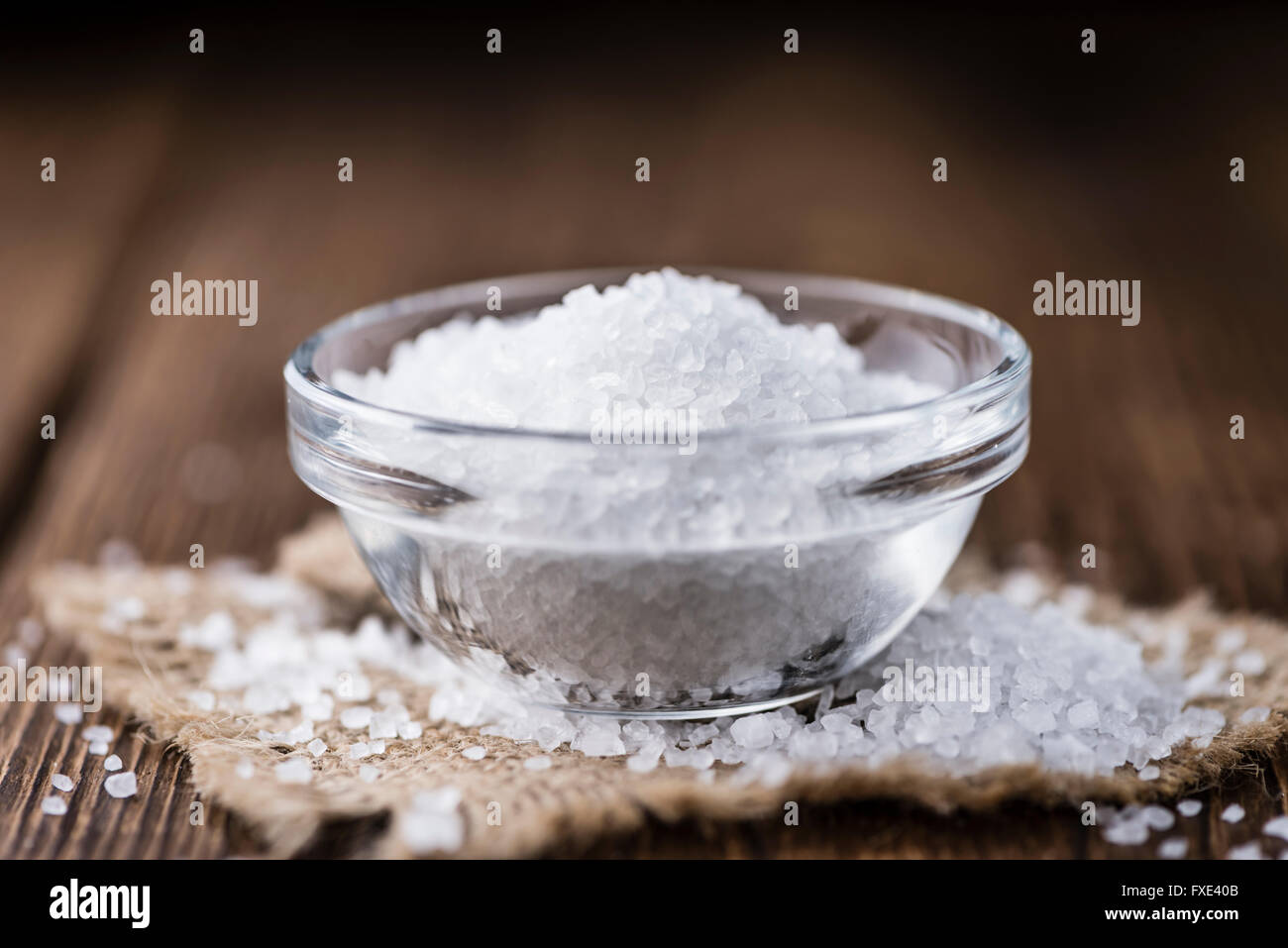 Heap of Coarse Salt (close-up shot) on vintage background (selective ...