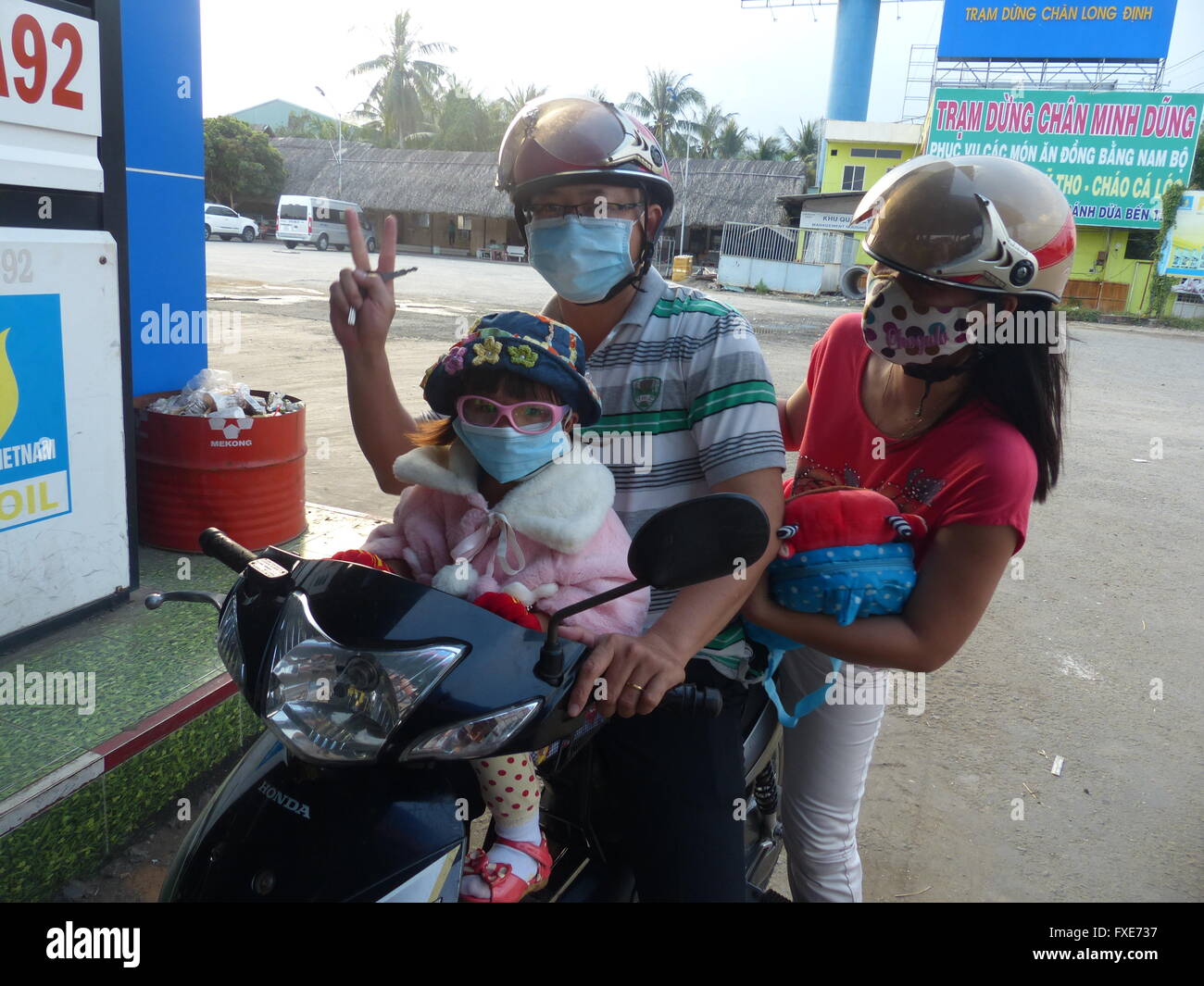 Family on motorcycle Stock Photo - Alamy
