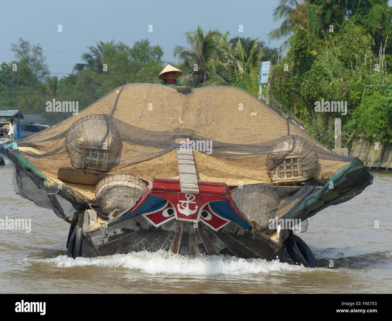 River barge laden with raw rice Stock Photo - Alamy