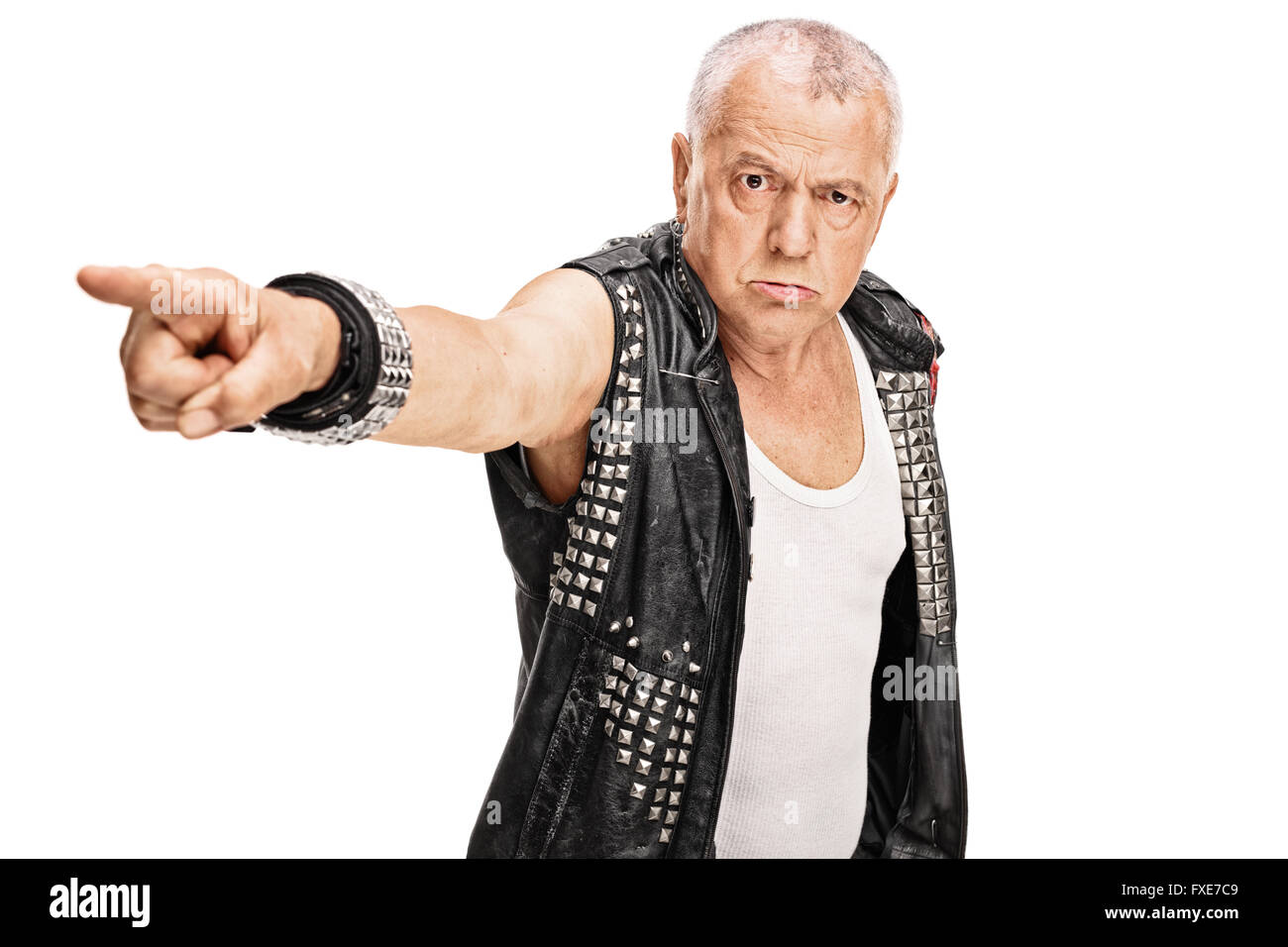 Angry mature punk pointing with his hand towards the camera isolated on ...
