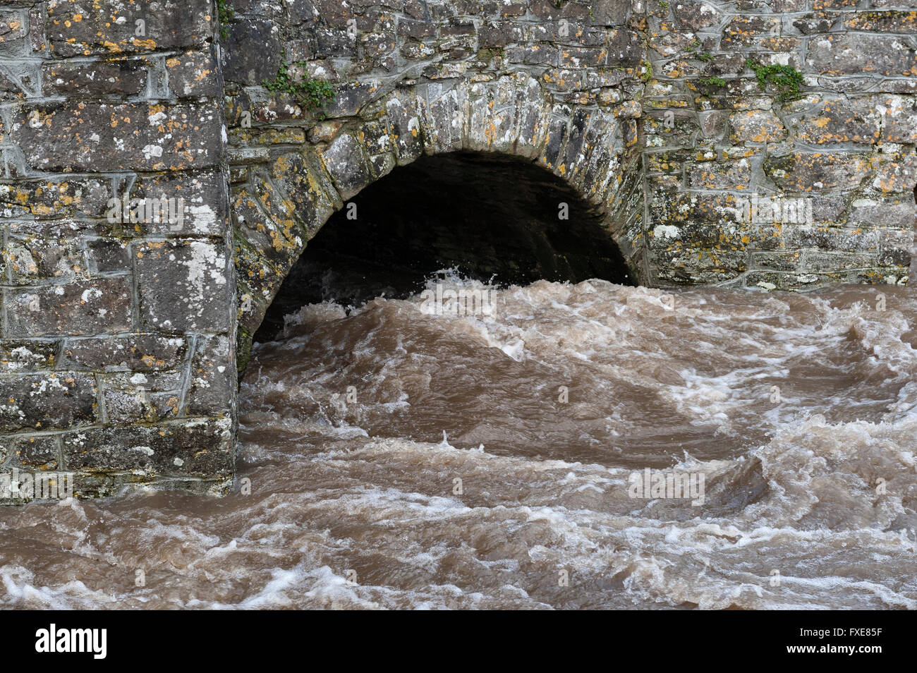 Presteigne, Powys, UK. The River Lugg in flood pouring beneath the ...