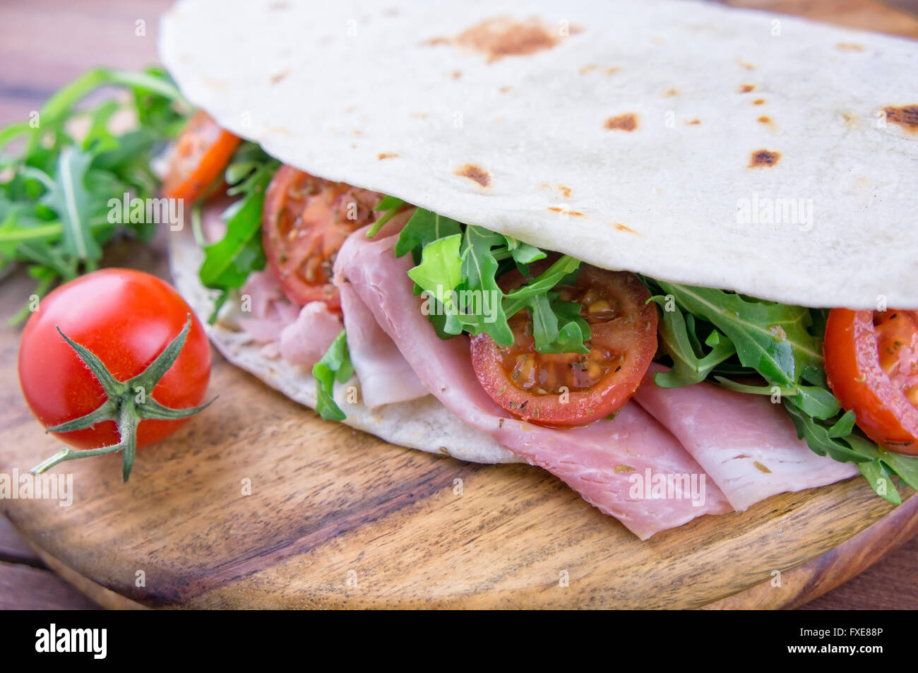 Piadina - traditional italian snack wrap on the table Stock Photo - Alamy