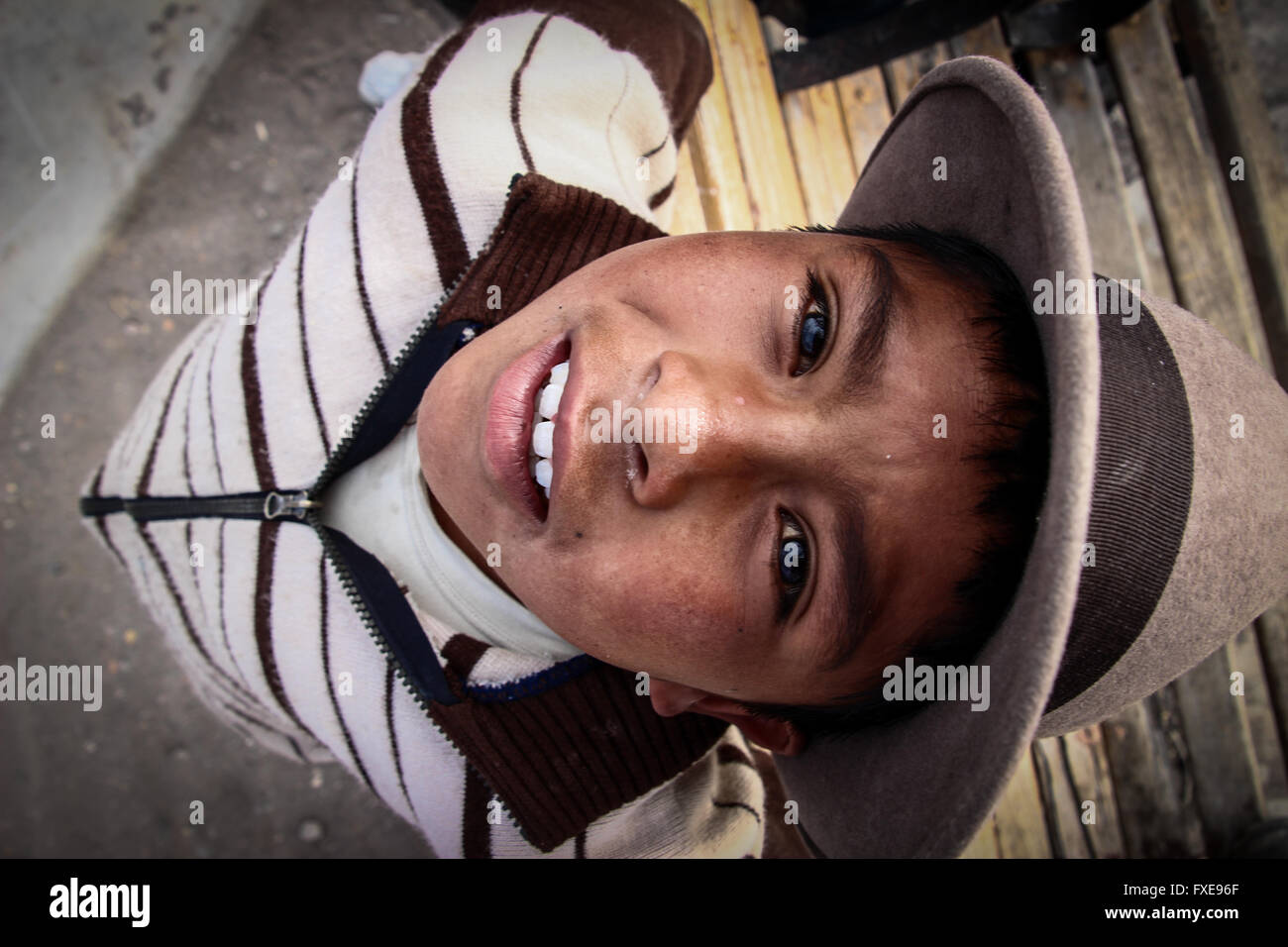Bolivia, a portrait from up of a smiling boy Stock Photo - Alamy
