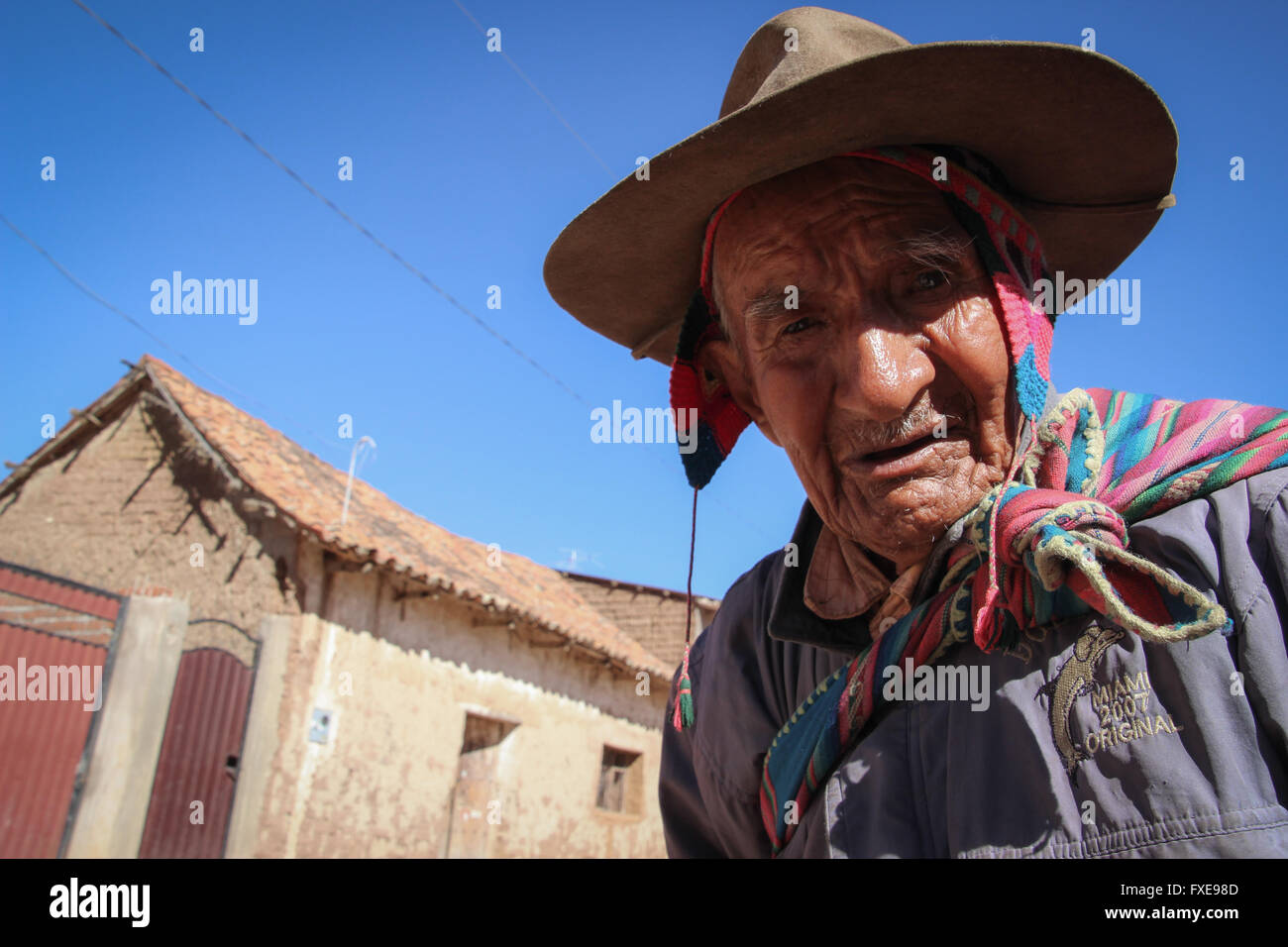 Bolivia, a portrait of an old man in traditional clothes on the street ...