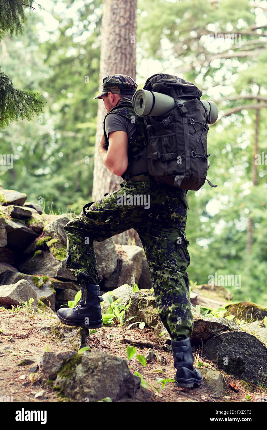 young soldier with backpack in forest Stock Photo - Alamy