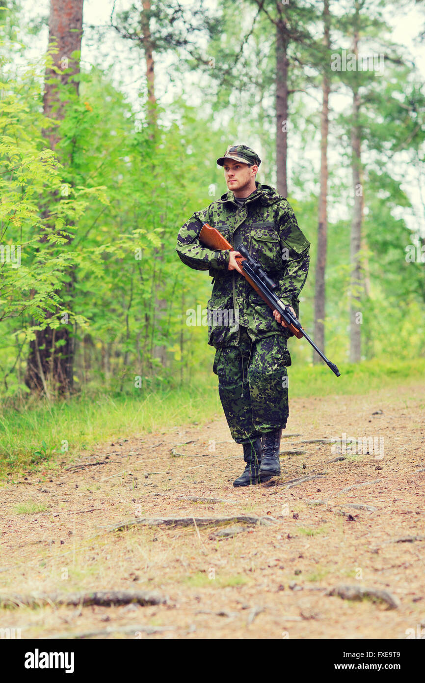 Hunter rifle walking woods hi-res stock photography and images - Alamy