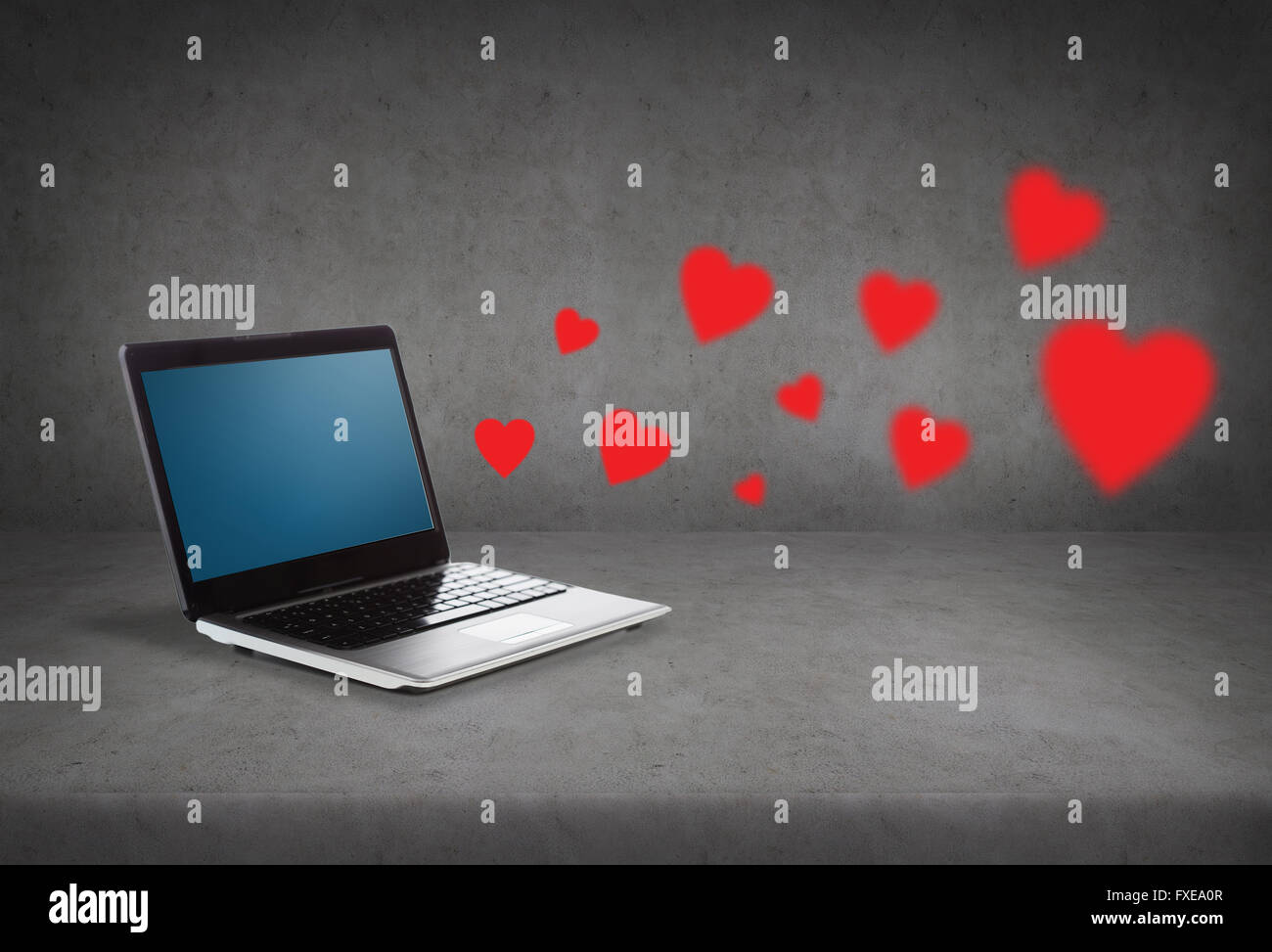 laptop with blank screen and red hearts Stock Photo - Alamy