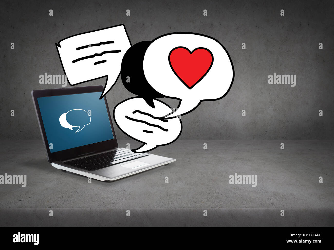 laptop computer with text bubbles on screen Stock Photo - Alamy