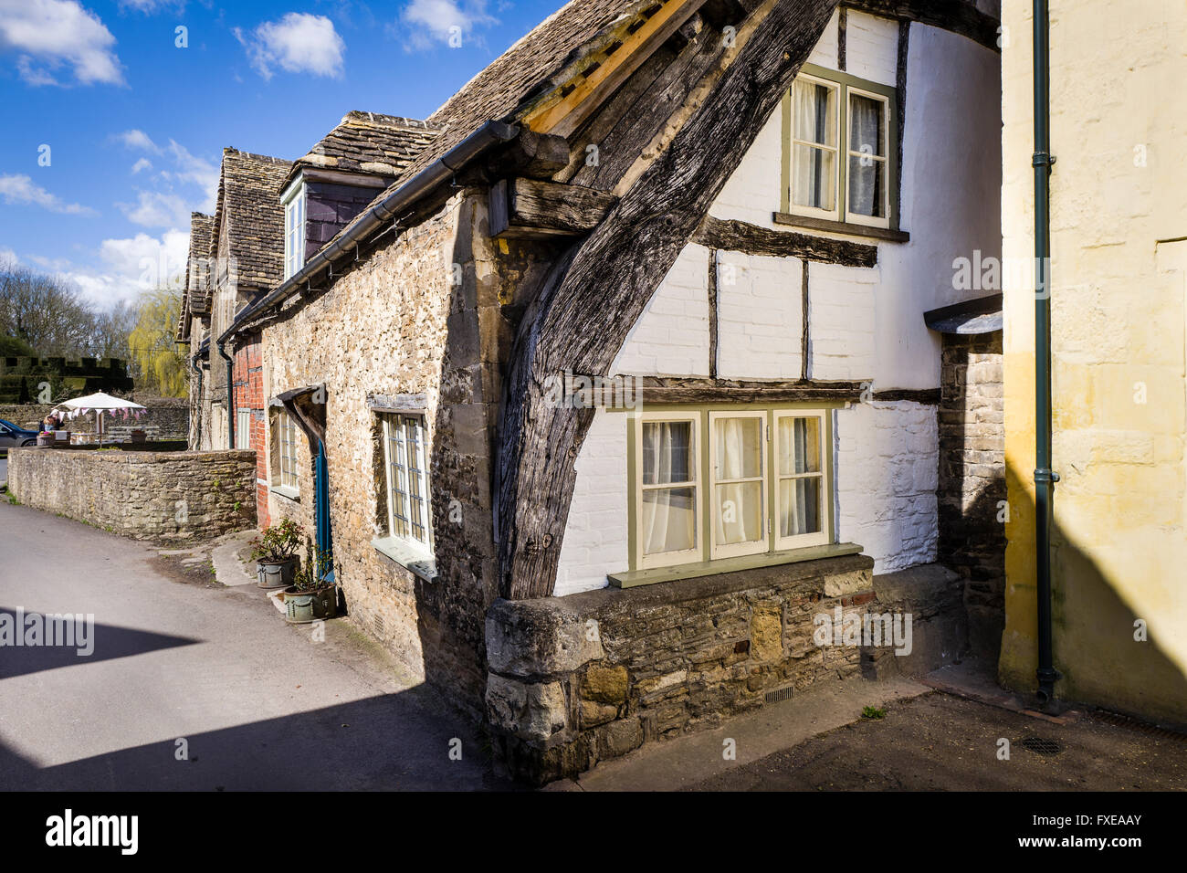 An old cottage in Lacock village UK showing the use of a cruck frame ...