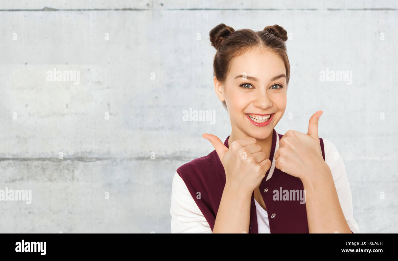 happy smiling teenage girl showing thumbs up Stock Photo - Alamy