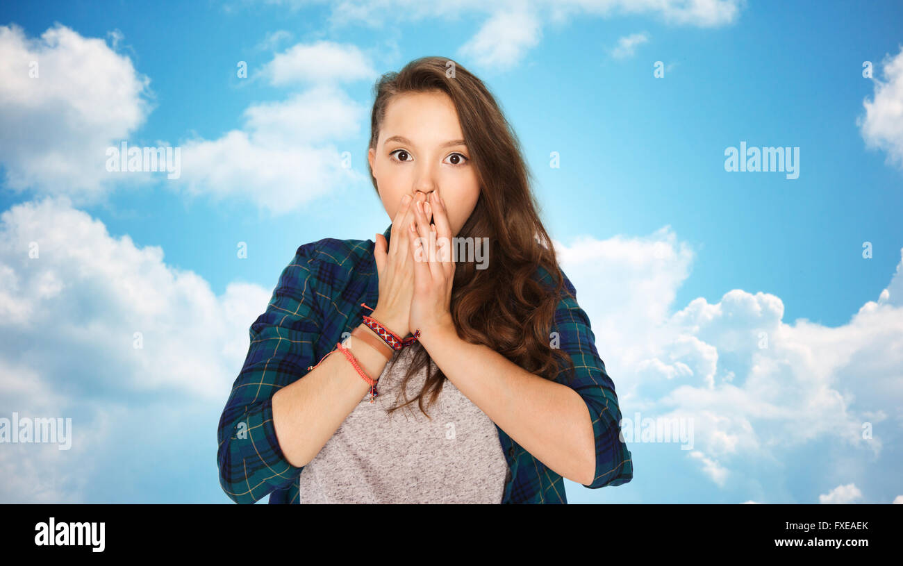 scared teenage girl over blue sky Stock Photo - Alamy