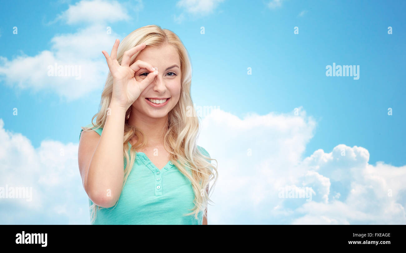 young woman making ok hand gesture Stock Photo - Alamy