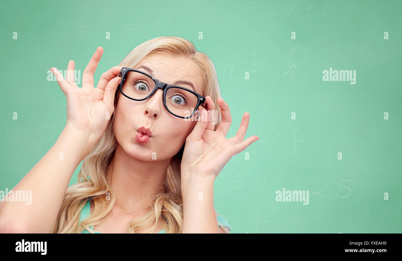 happy young woman in glasses making fish face Stock Photo - Alamy