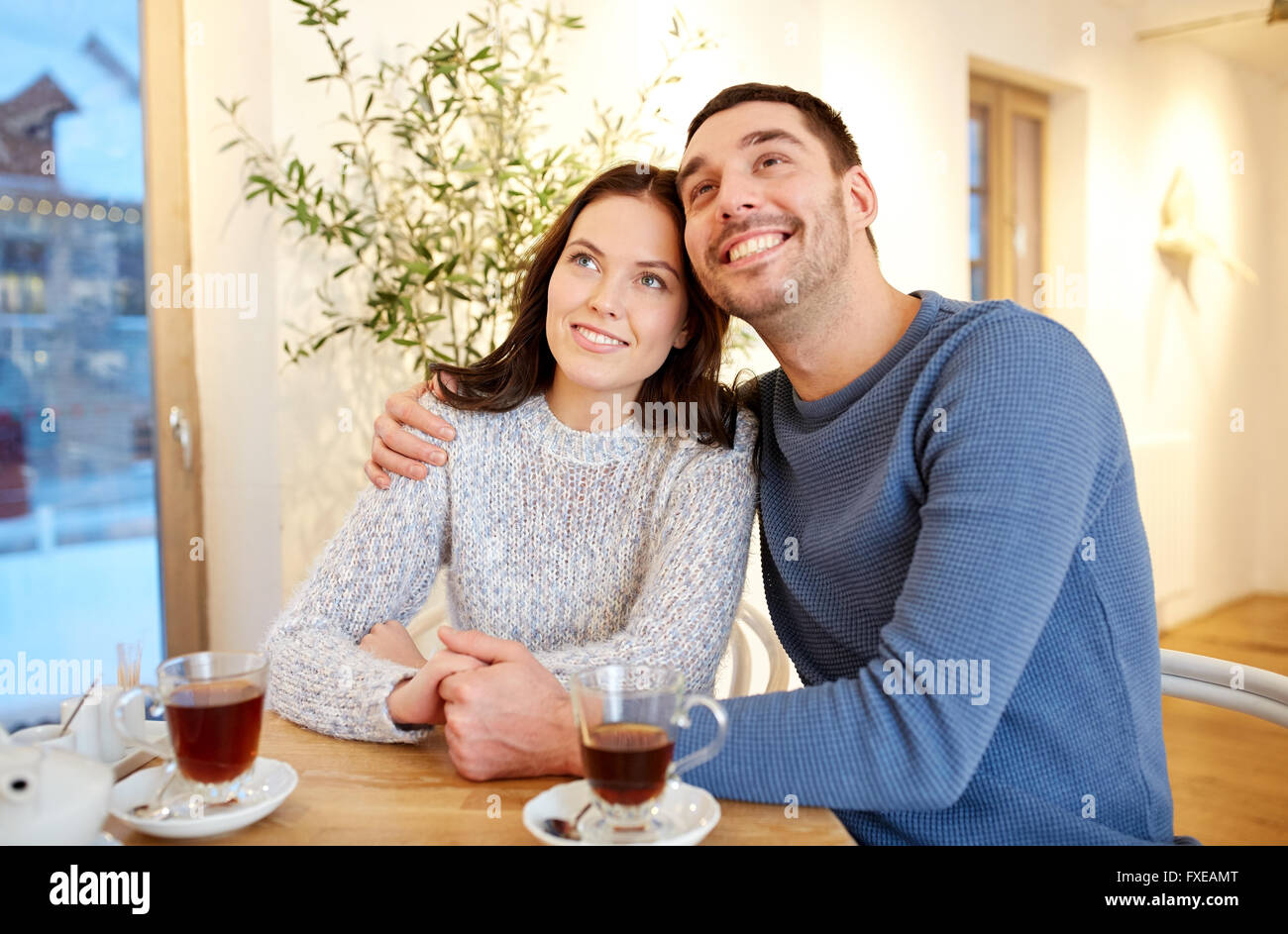 happy couple drinking tea at restaurant Stock Photo - Alamy