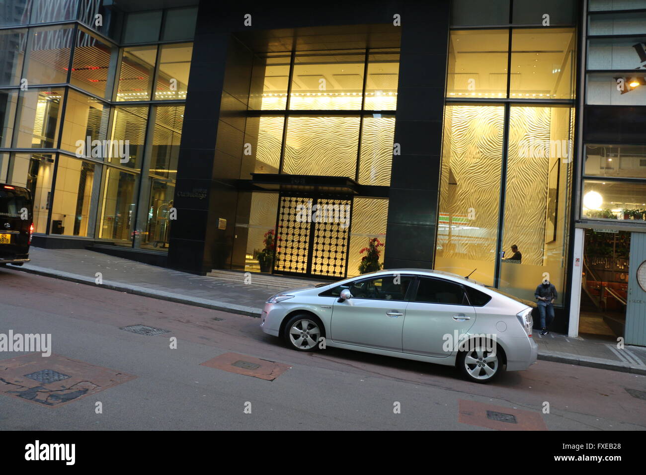 Parked car in front of office building hi-res stock photography and ...
