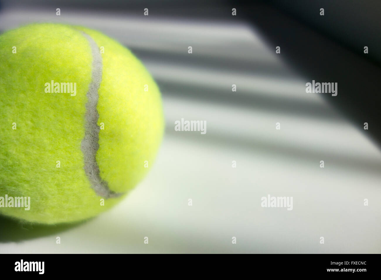 Tennis ball with shadows Stock Photo - Alamy