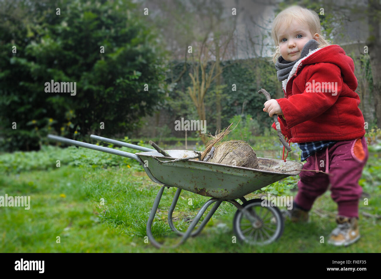 Child with a wheelbarrow child with a wheelbarrow hi-res stock ...