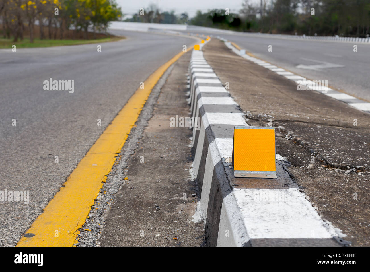 curve road and reflextive marking on footpath Stock Photo - Alamy