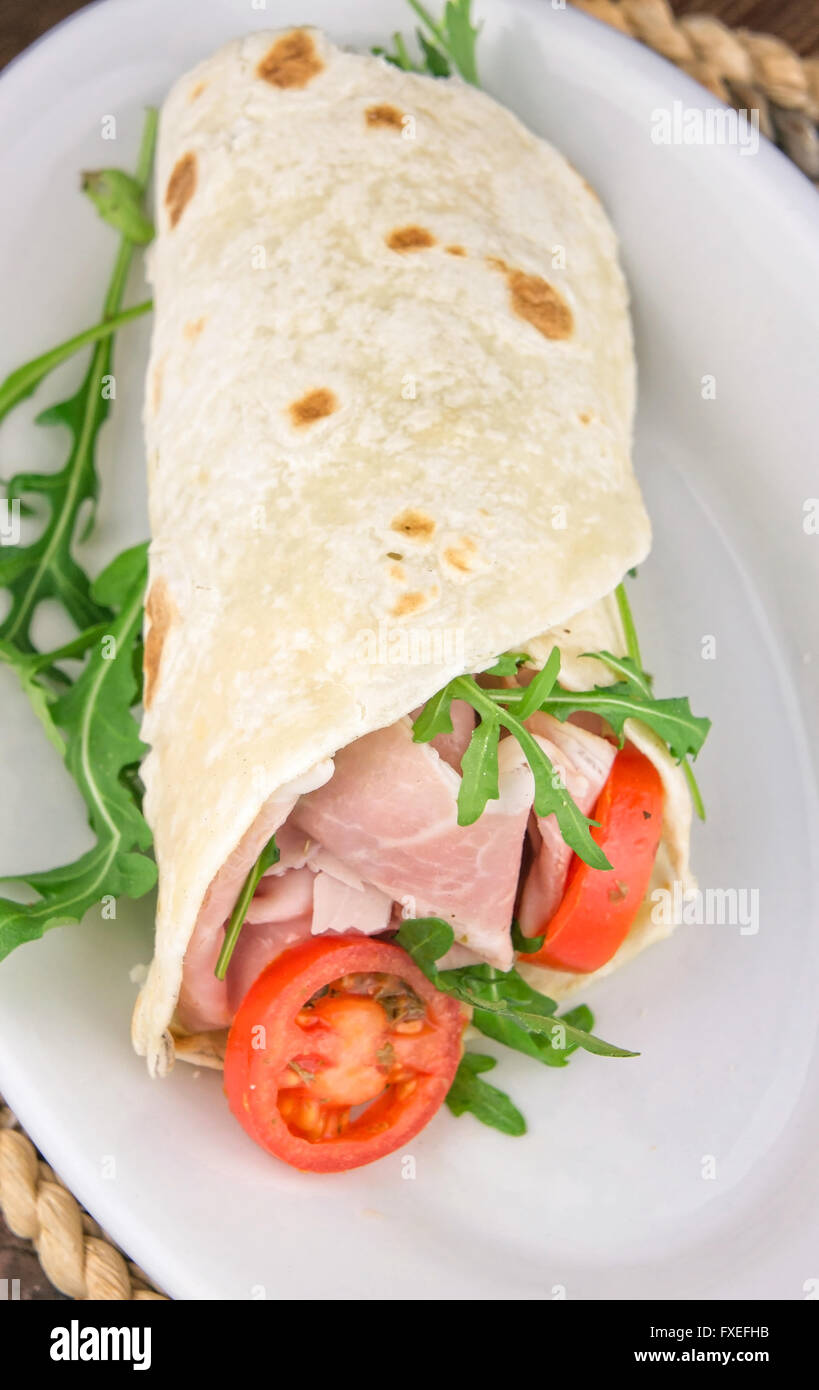 Piadina - traditional italian snack wrap on the table Stock Photo - Alamy
