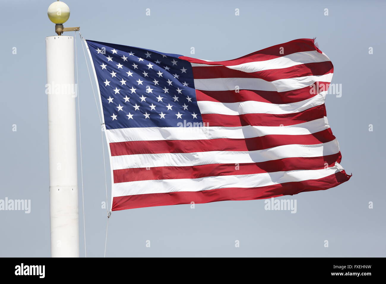 United States flag flying on cell phone pole at tennis stadium in ...