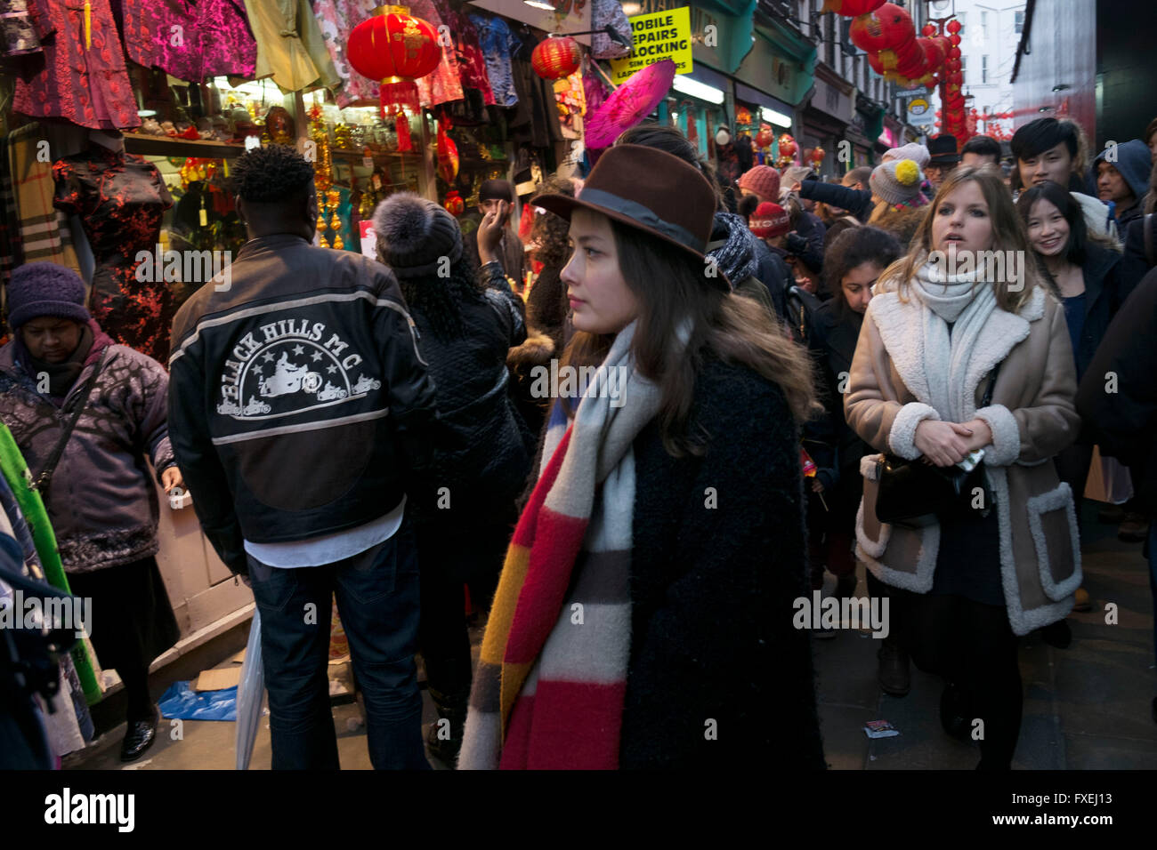 Crowds of people squeeze into a narrow street Chinatown during Chinese ...