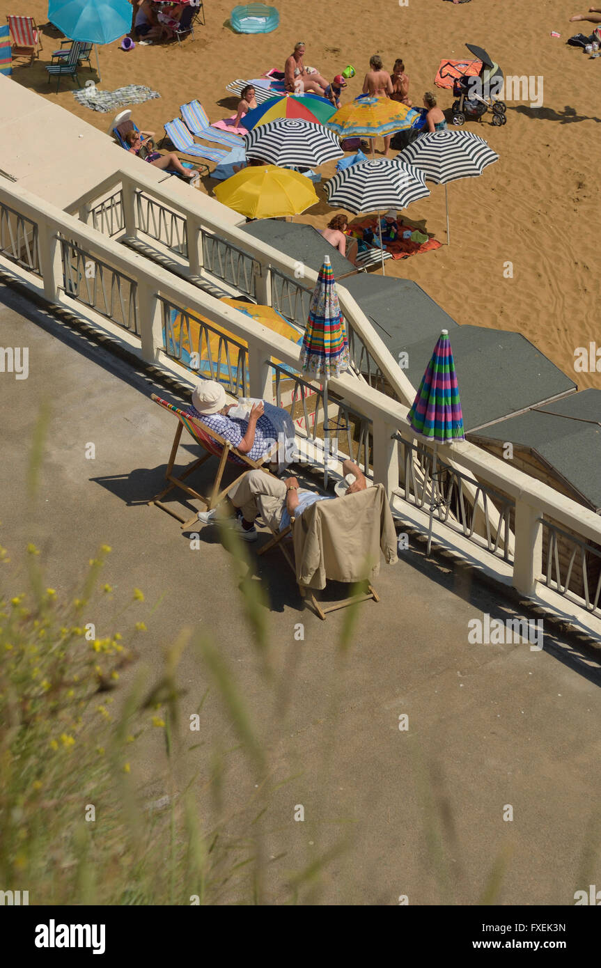 Mature couple sunbathing on beach hi-res stock photography and images ...