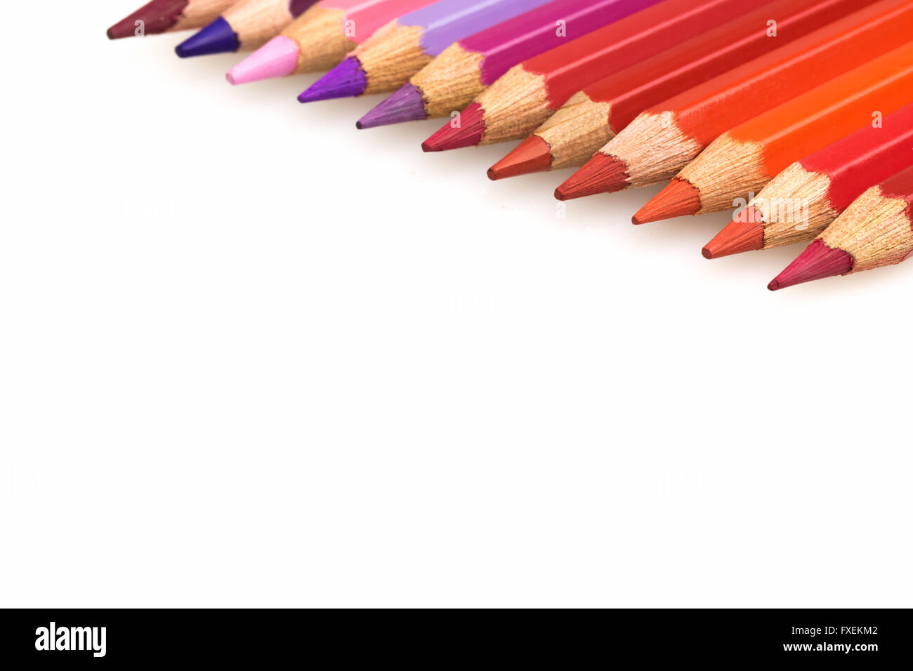 Crayons of different shades of red with copy space are located in the ...