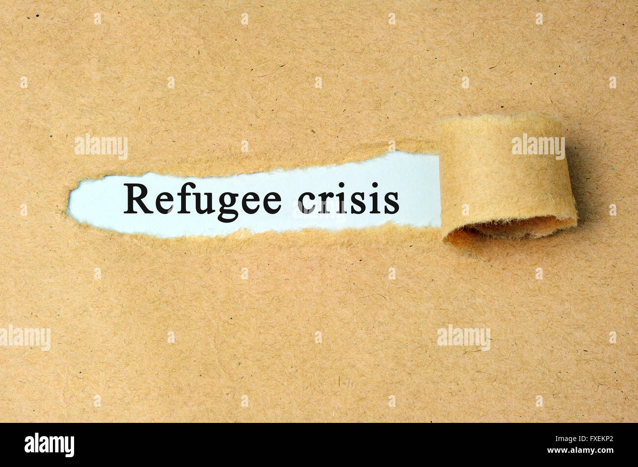 Ripped paper with "refugee crisis" text Stock Photo - Alamy